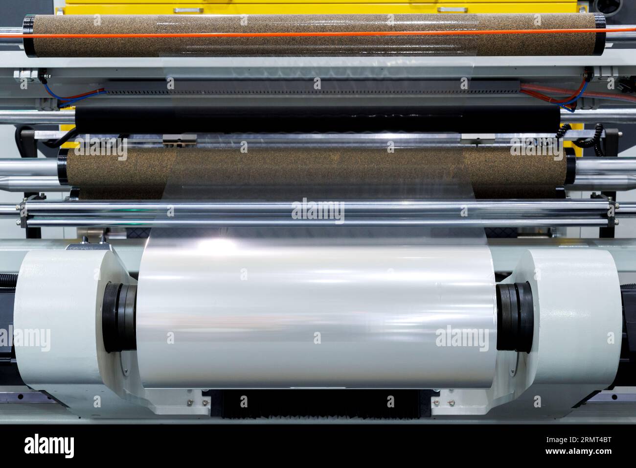 roll of plastic packaging film on the automatic packing machine in food ...