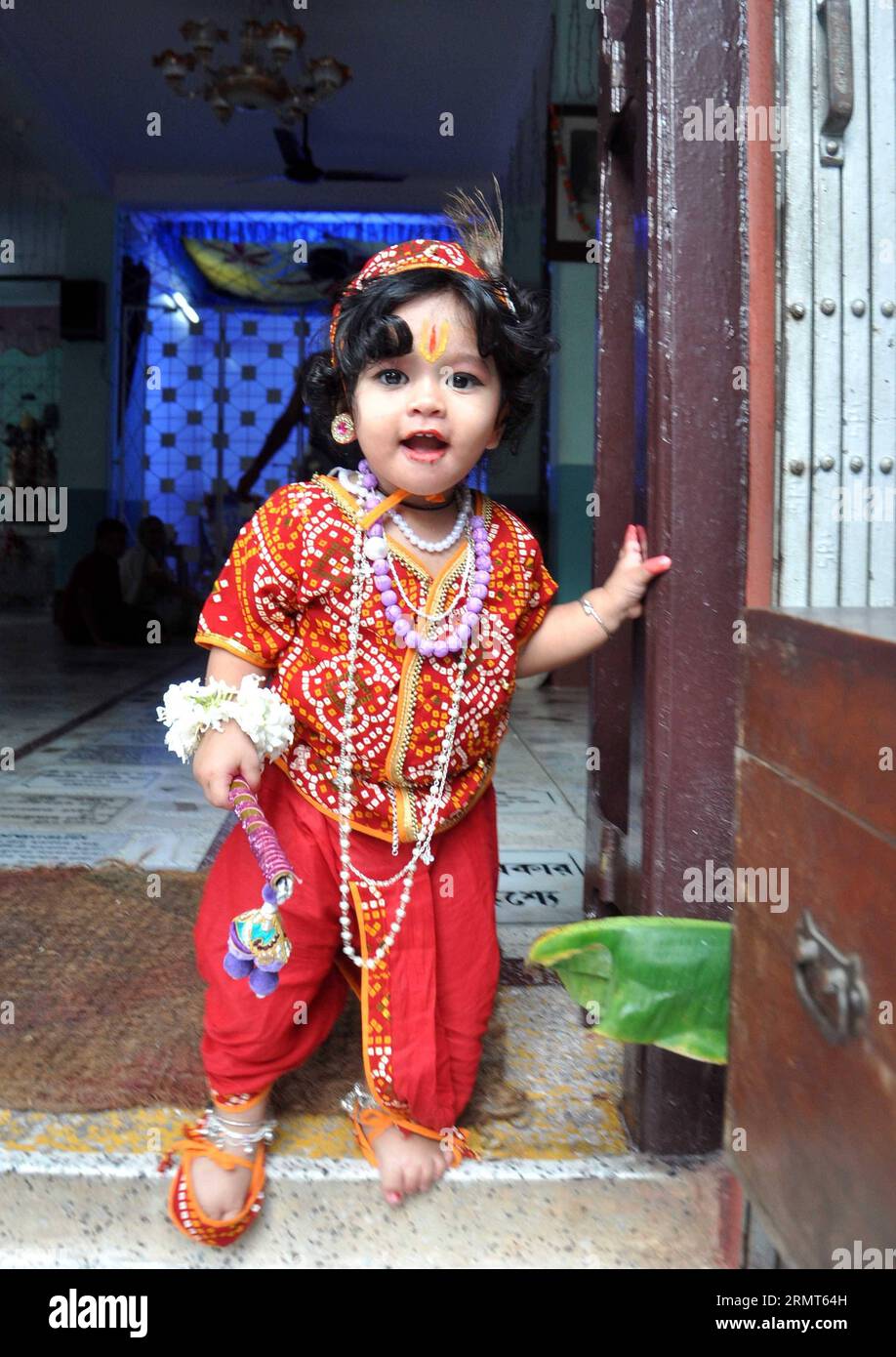 An Indian toddler dressed as Hindu God Krishna takes part in Krishna ...
