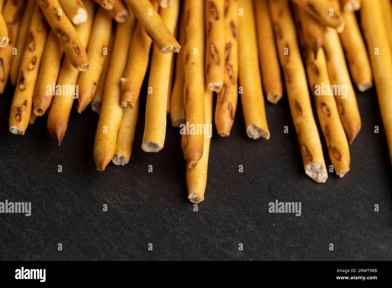 Thin and long bread sticks made of wheat flour on the table Stock Photo ...