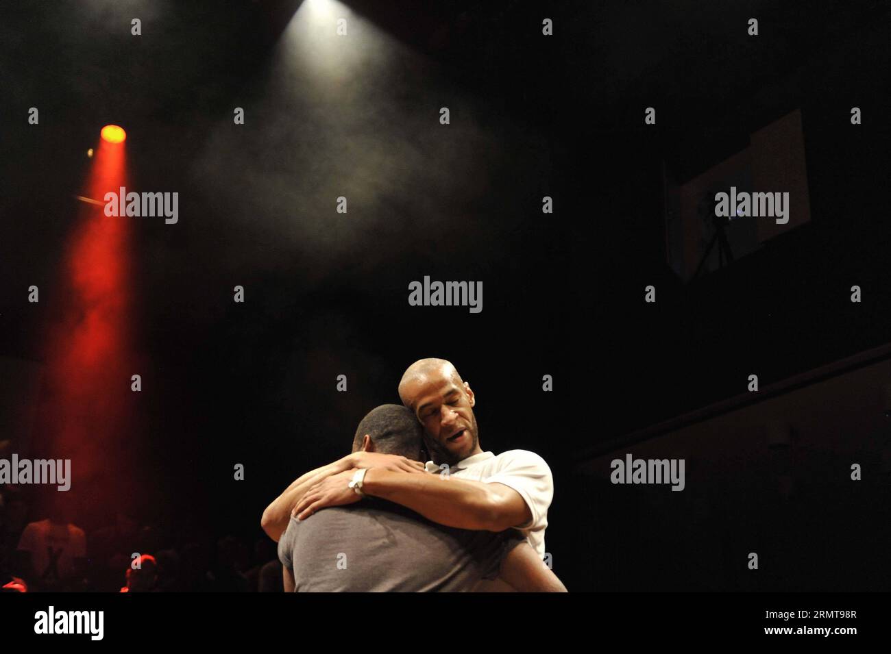 Dancers hug with each other after a round of house dance competition ...