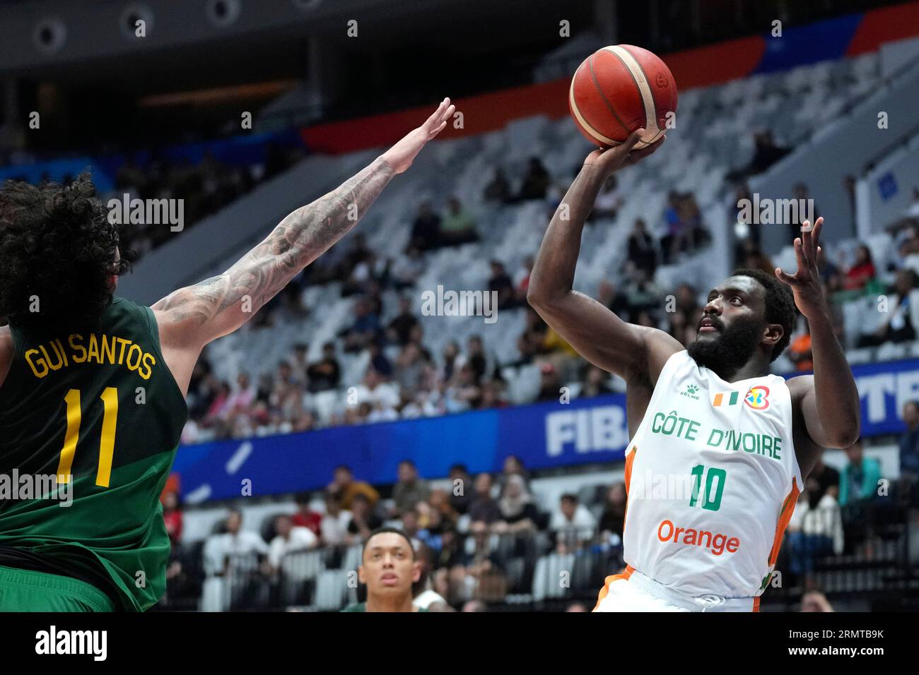 Ivory Coast guard Solo Diabate (10) shoots over Brazil guard Gui ...
