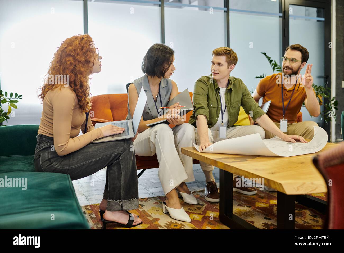 startup project, business team with laptop and documents talking near ...