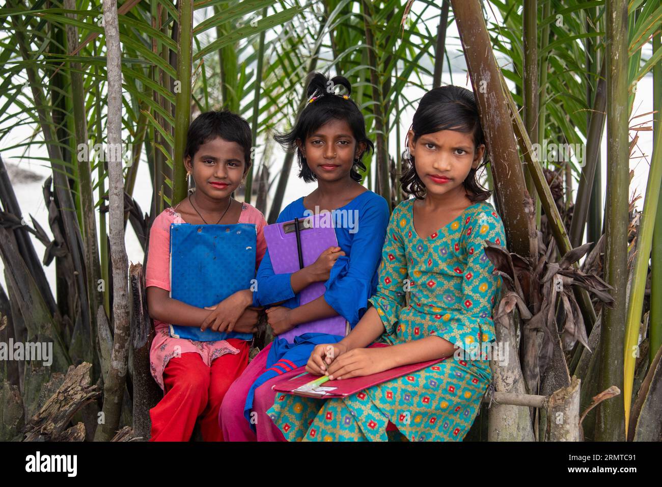 Majia Akhtar (L) 9-years old Karima Begum, 10-years old (M) Sariya ...