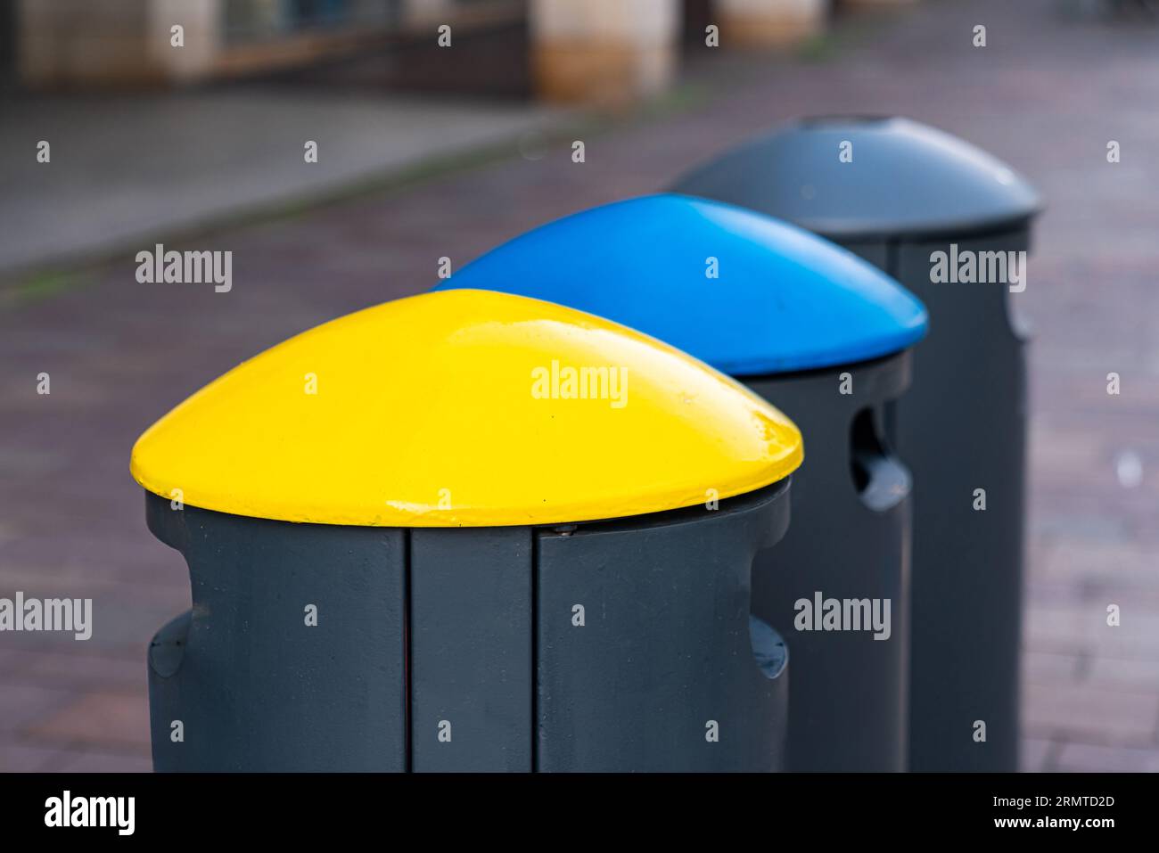 Multi Colored Lids Of Garbage Cans In The Pedestrian Zone Of The City