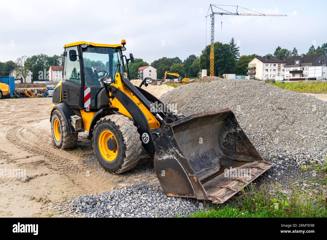 Yellow hydraulic wheel gravel loader at construction site. Powerful ...