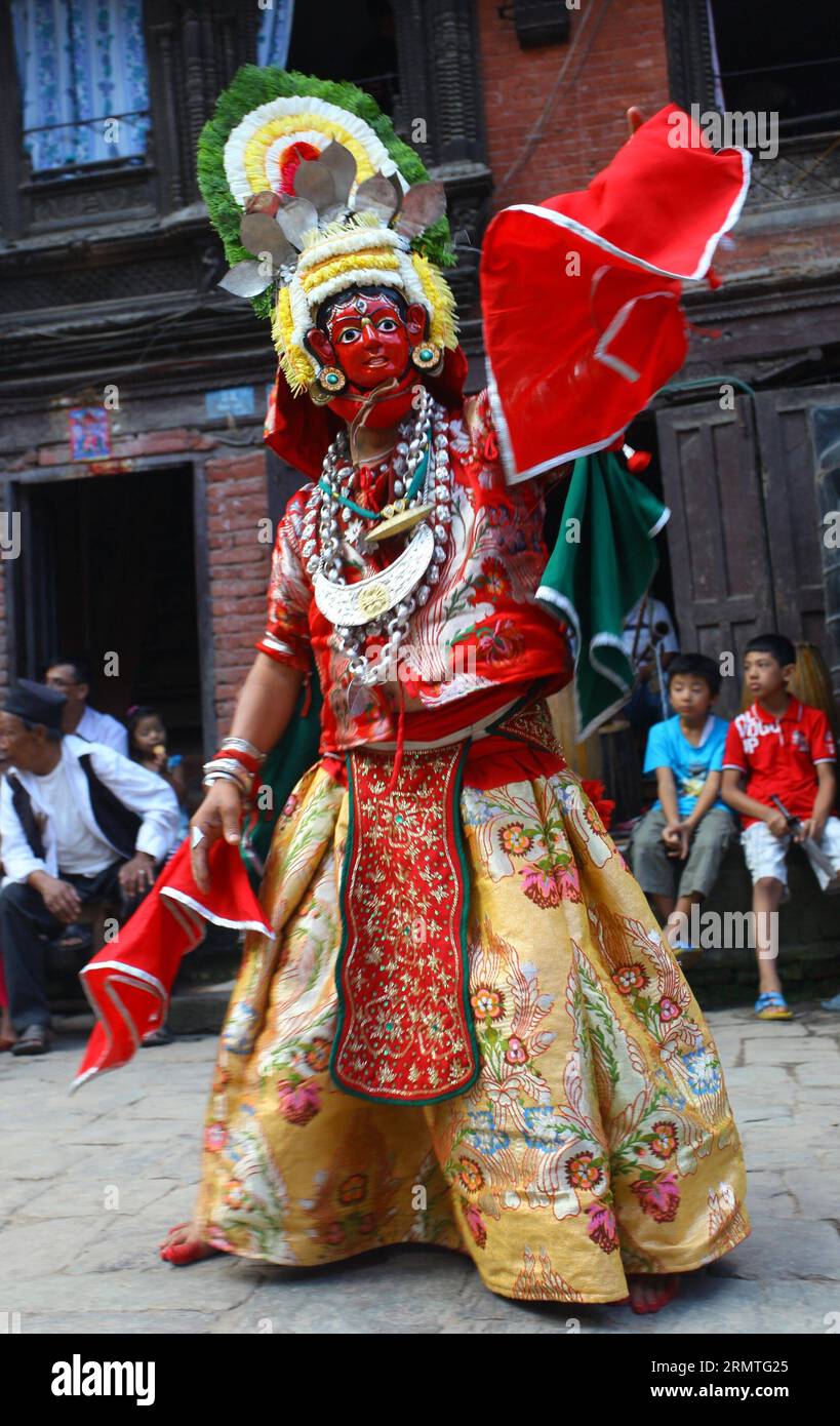 (140903) -- KATHMANDU, Sept. 3, 2014 -- A masked dancer performs as ...