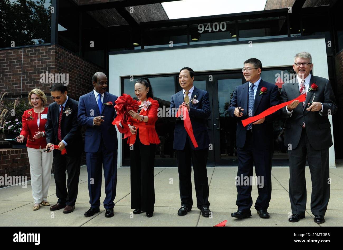 A ribbon-cutting ceremony is held marking the official launch of Tasly ...