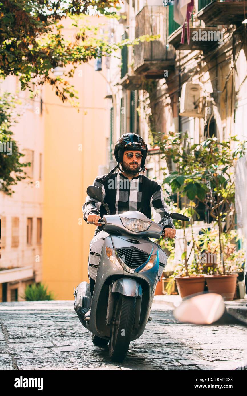 Naples, Italy. Man Riding On Scooter At Vico S. Nicola Da Tolentino ...