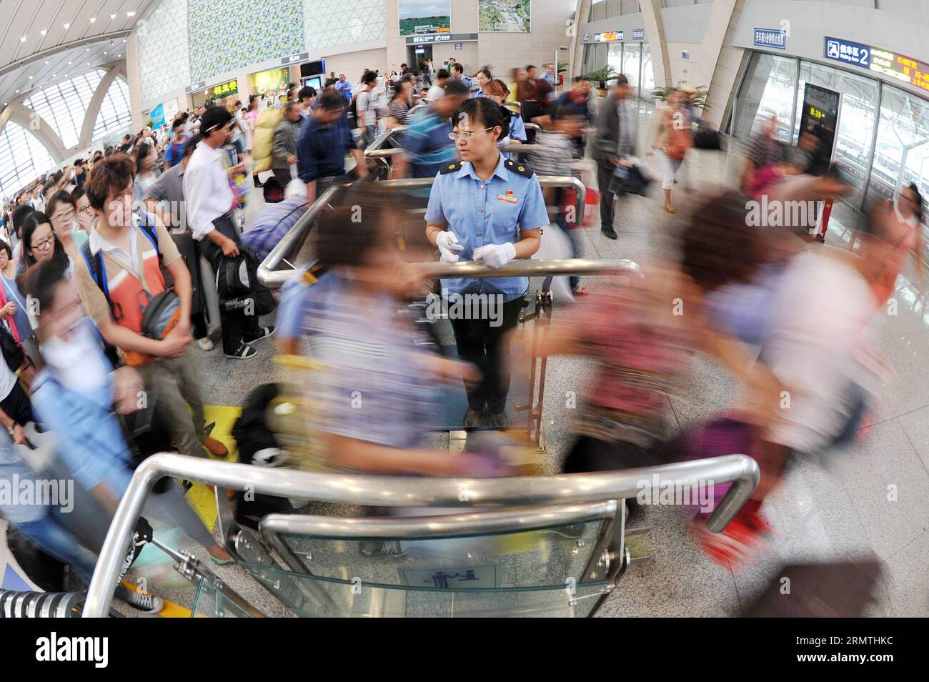 Passengers check in at the railway station of Yinchuan, capital of ...
