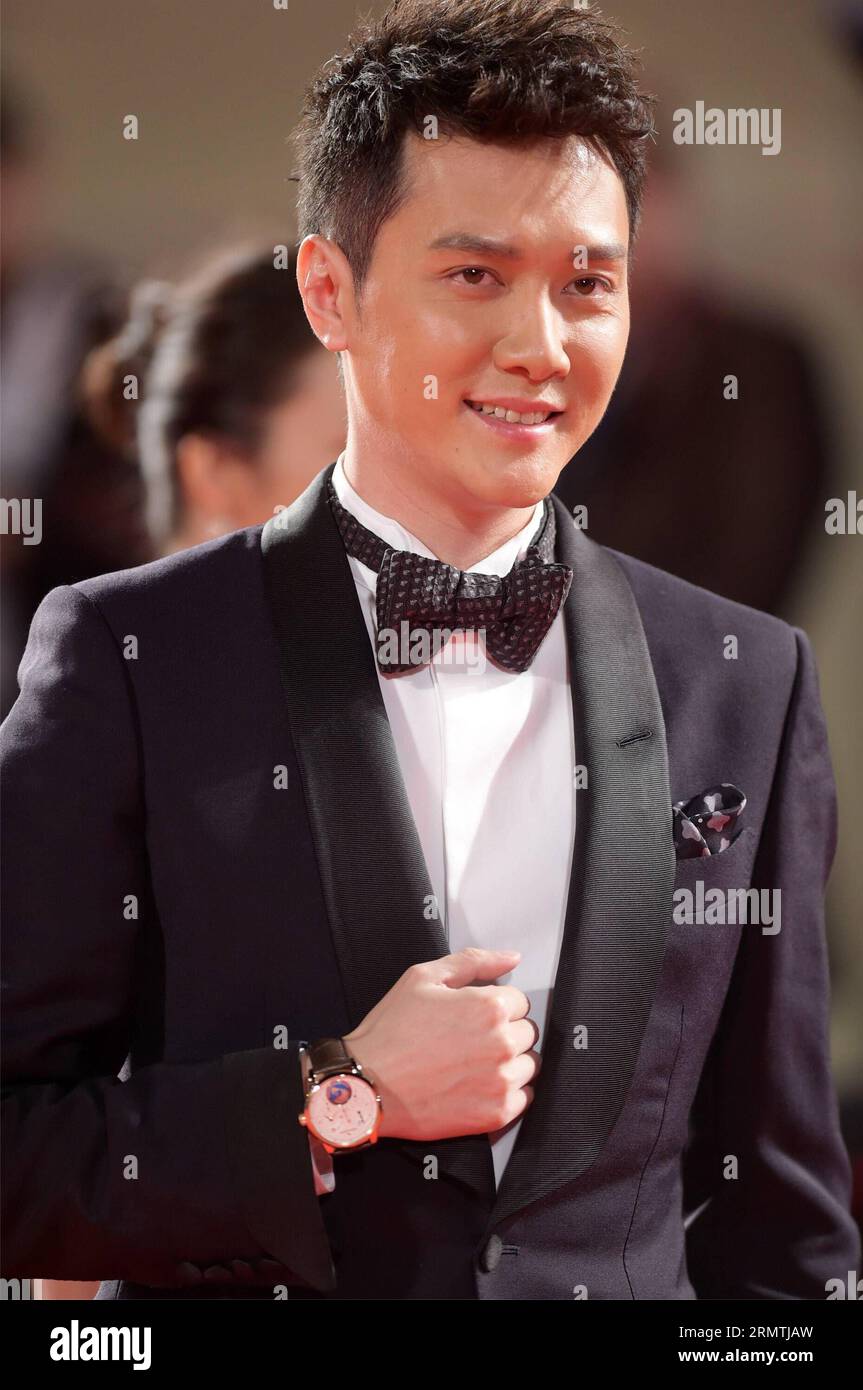 Actor Feng Shaofeng poses on the red carpet for the awards ceremony at ...