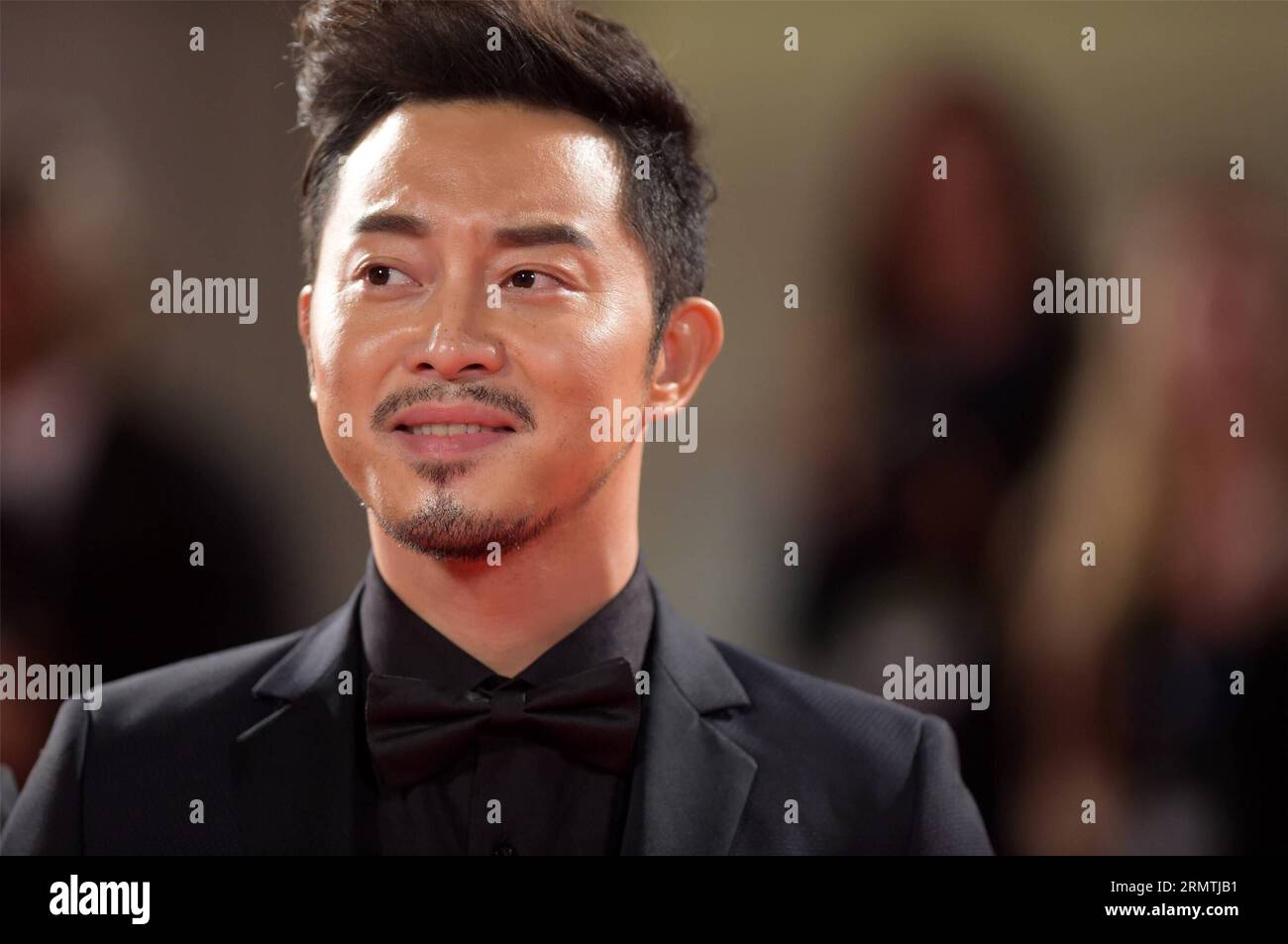 Actor Sha Yi poses on the red carpet for the awards ceremony at the ...
