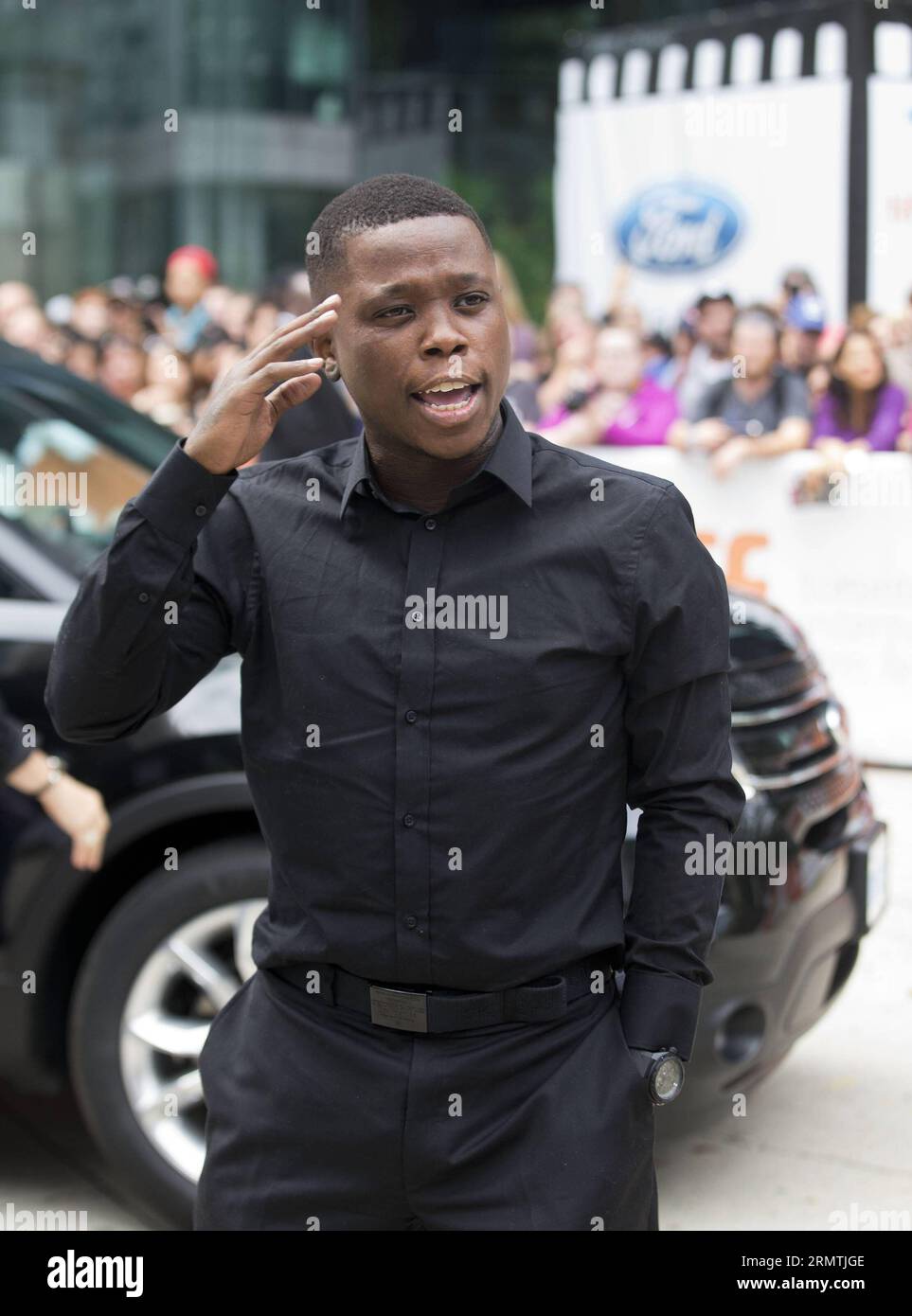 Actor Mpho Koaho poses for photos before the premiere of the film Black ...