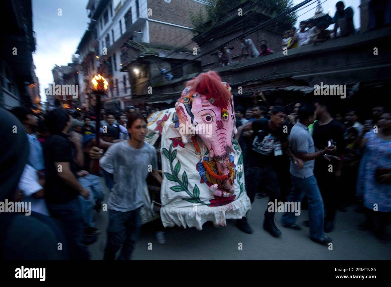 A Nepalese devotee performs the Pulukishi, or traditional elephant ...