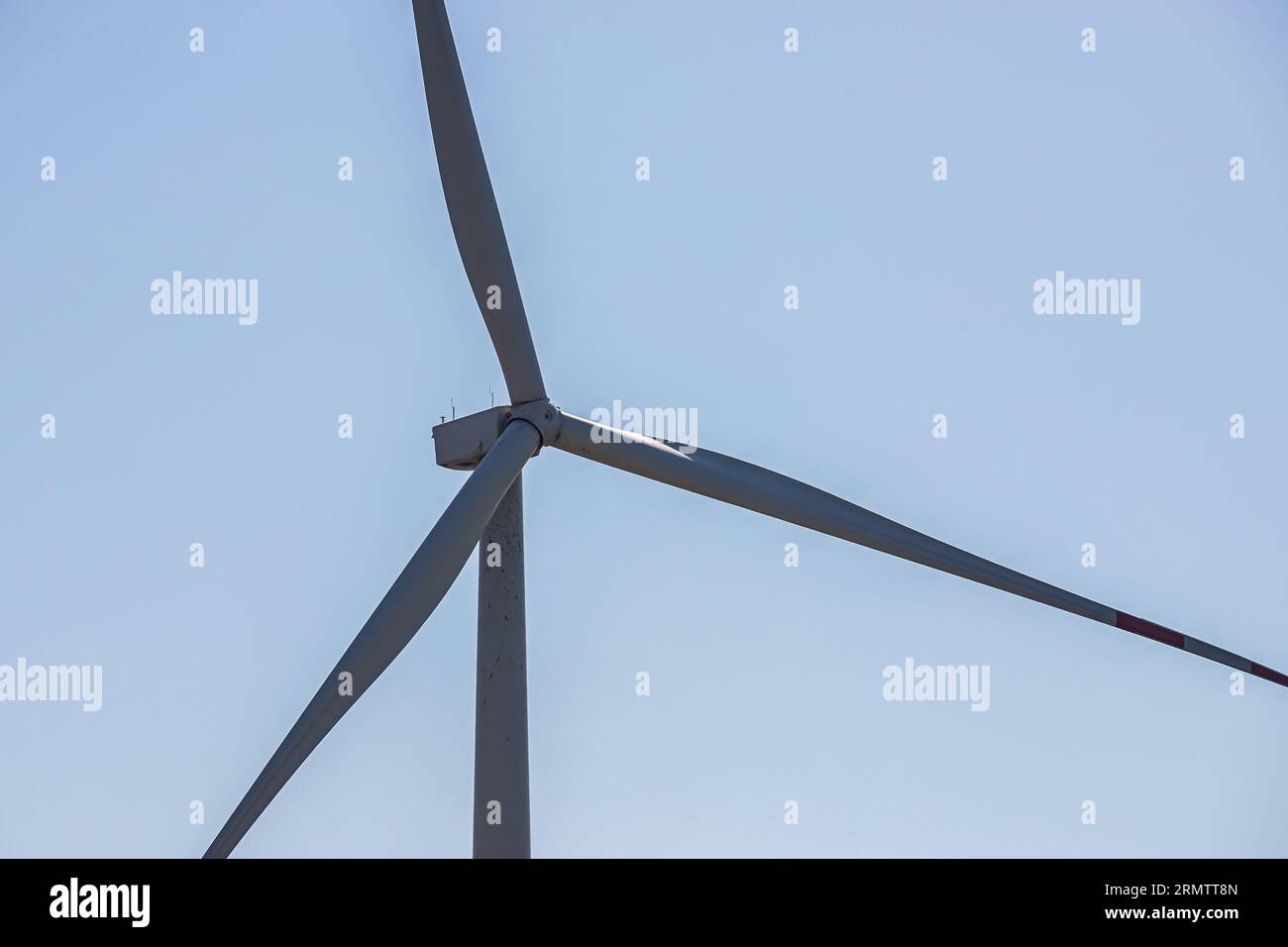 wind mill or also wind-turbine on wind farm in rotation to generate ...