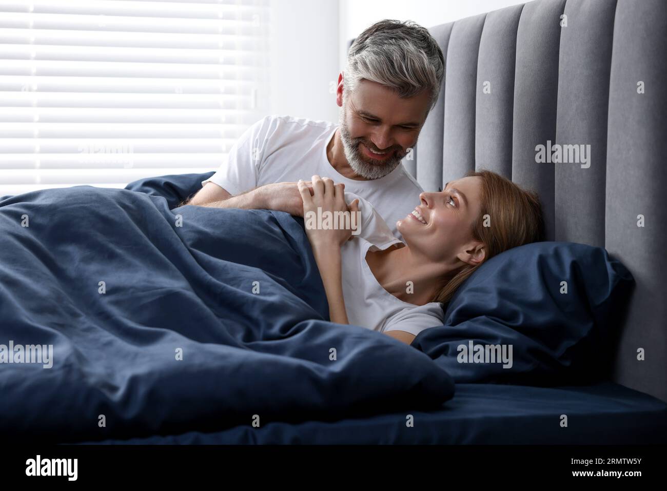 Lovely mature couple in bed at home Stock Photo - Alamy