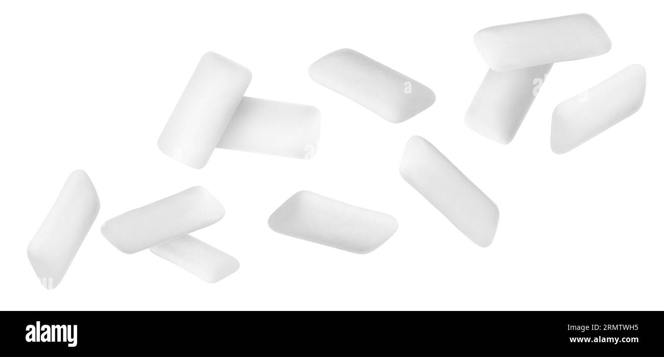 Many chewing gum pads falling on white background Stock Photo - Alamy