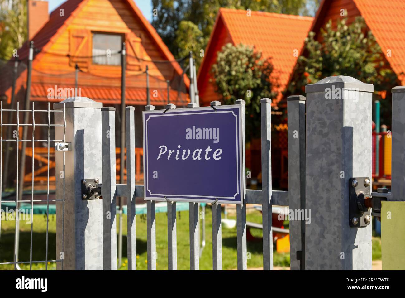 Blue sign with word Private on fence Stock Photo - Alamy
