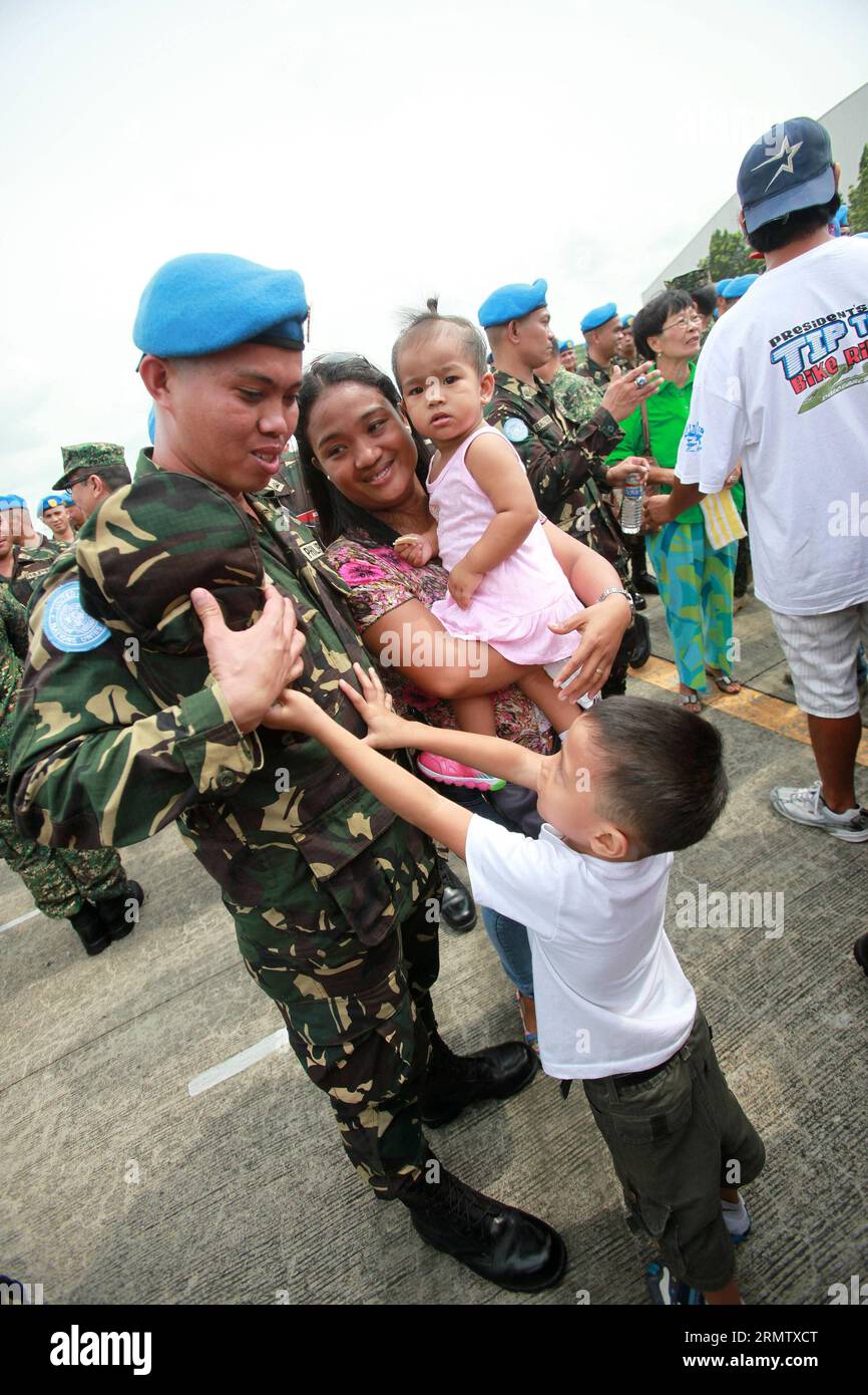 A soldier of Armed Forces of the Philippines (AFP) says goodbye to his ...