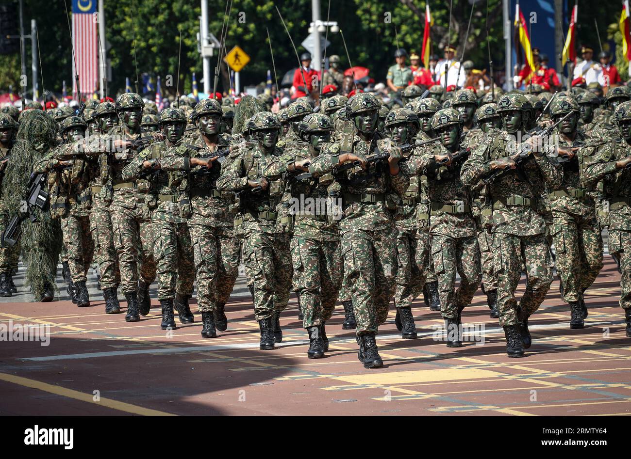 Malaysian Armed Forces personnel march during parade rehearsal in preparation for the National ...