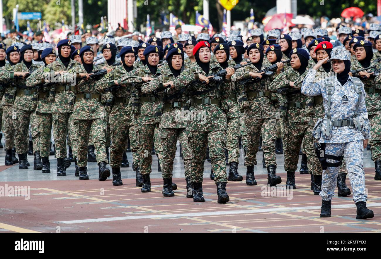 Malaysian Armed Forces personnel march during parade rehearsal in preparation for the National ...