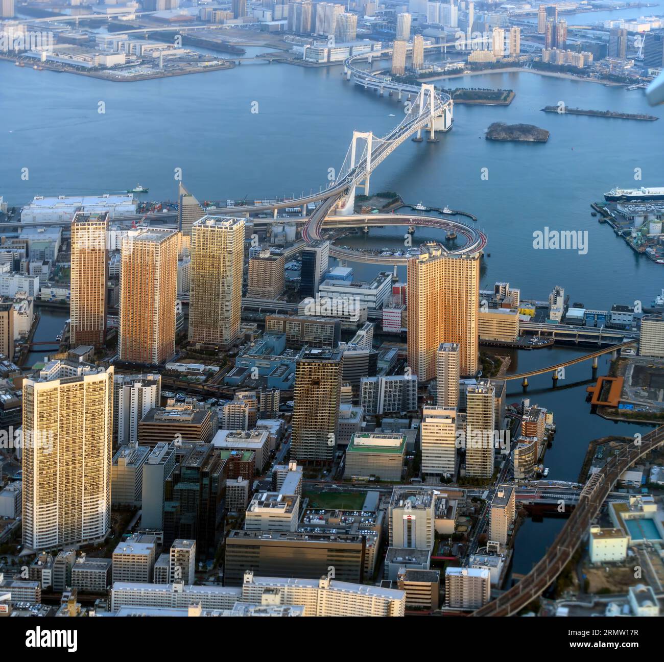 Tokyo metropolis at Shibaura with Rainbow Bridge to Daiba Park. Aerial ...