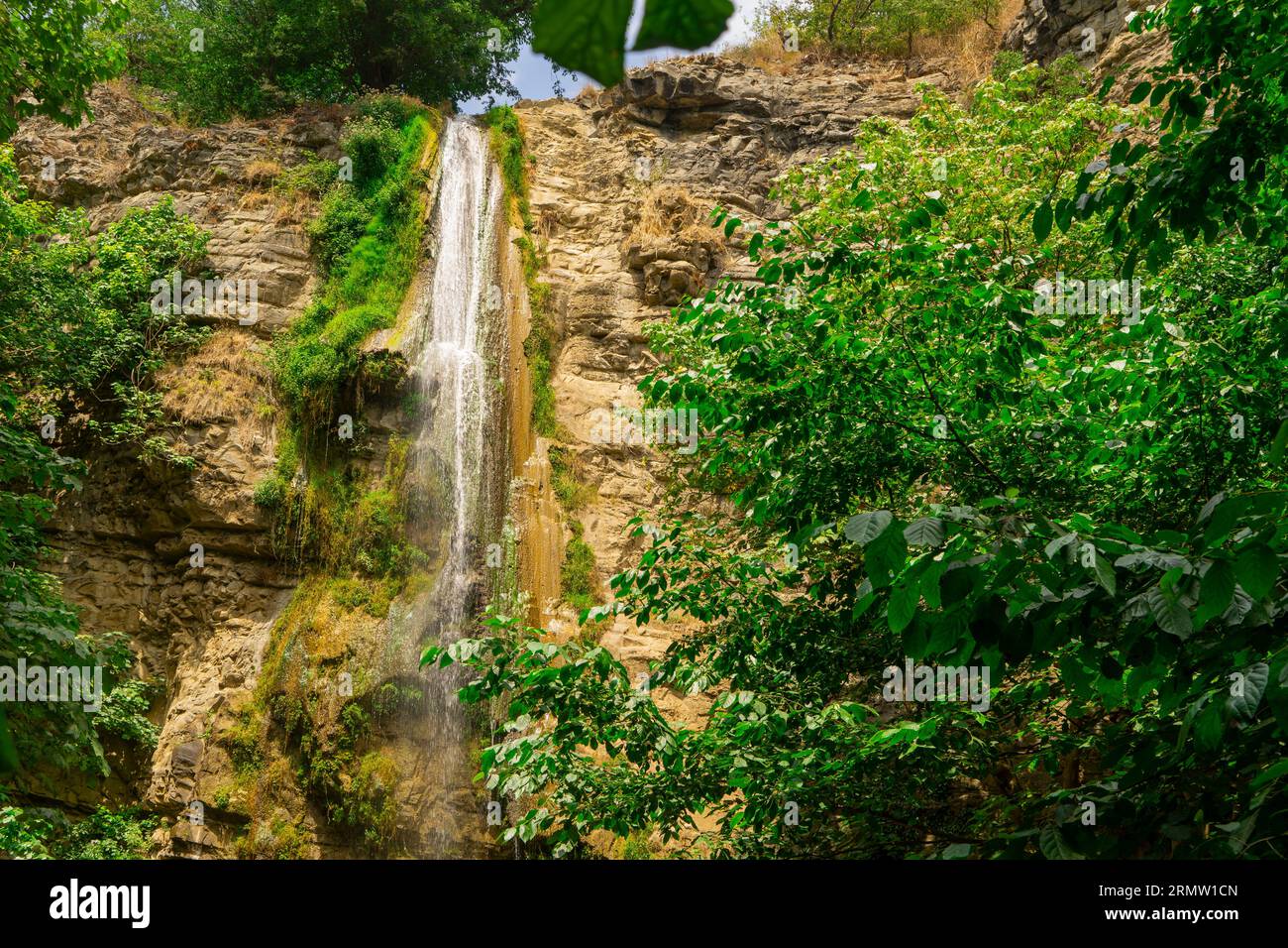 Beautiful waterfall of the Caucasus Mountains, stormy mountain water ...