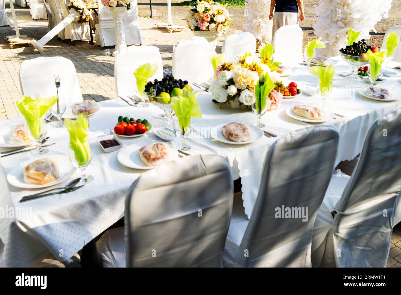 Elegant banquet tables prepared for a conference or a party and covered ...