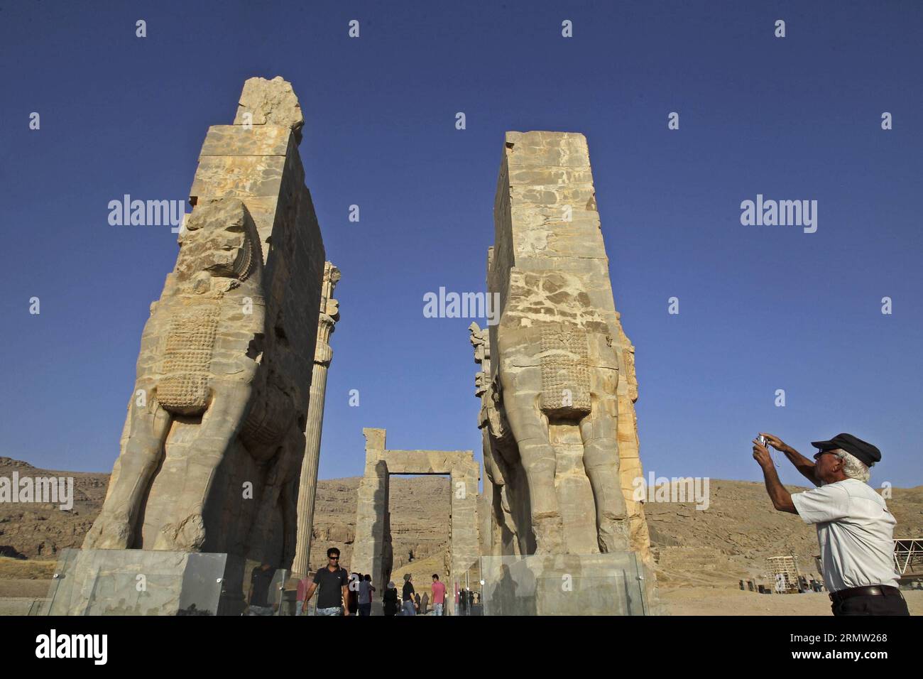 Tourists visit the ancient Persian city of Persepolis outside Shiraz ...
