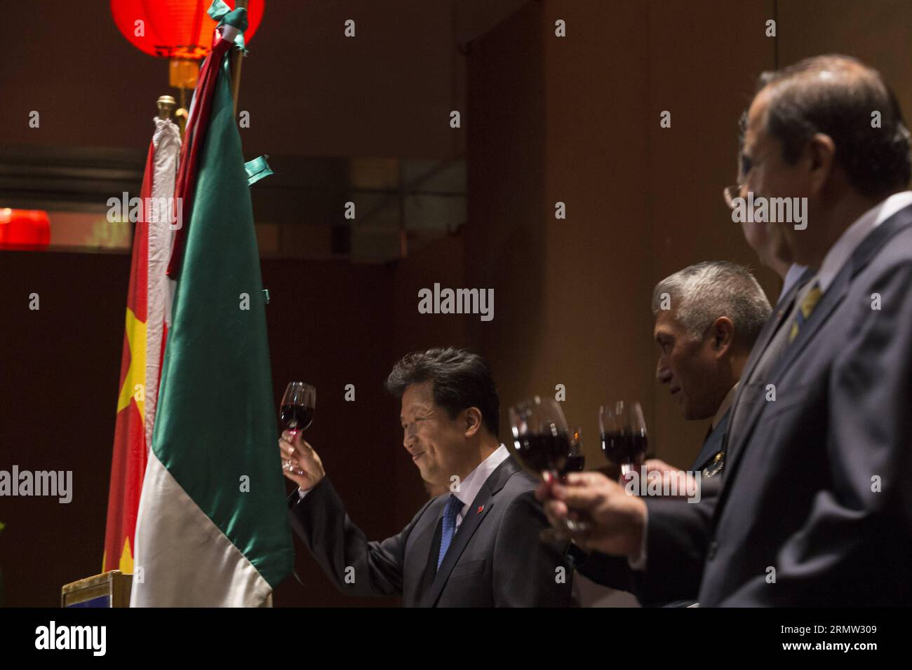 Chinese Consul General in Tijuana, Wang Jian (L), takes part in an ...