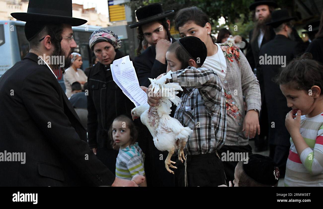 (141001) -- JERUSALEM, Oct. 1, 2014 -- Ultra-Orthodox Jews swing a ...