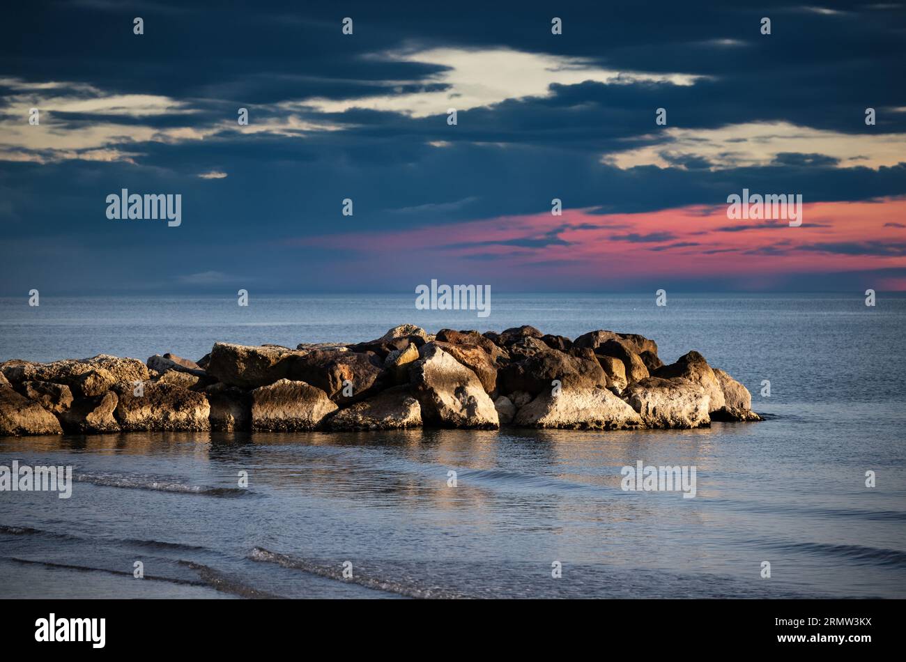 seascape rocks illuminated by the sunset Stock Photo - Alamy