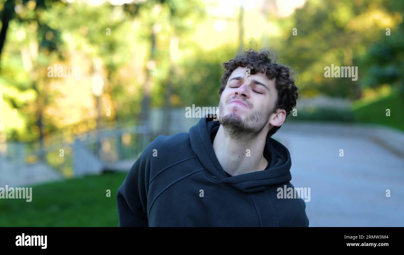 Young Caucasian man feeling pain after working out. Sportsman running ...
