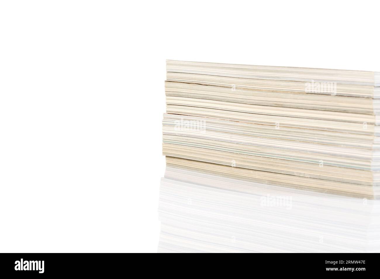 A stack of magazines isolated on a white background Stock Photo - Alamy