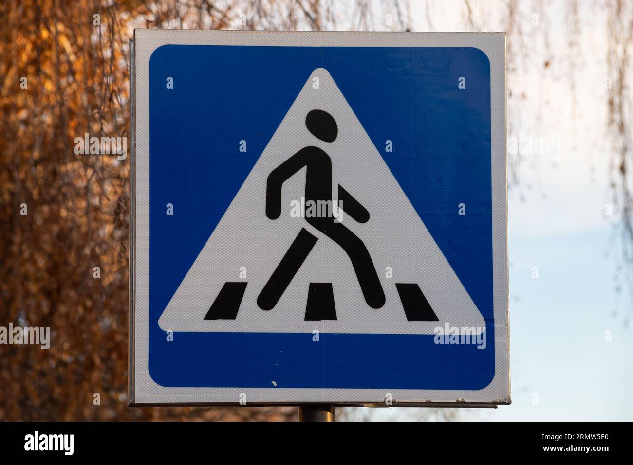 Traffic indicating sign, a blue crosswalk sign for pedestrians crossing ...