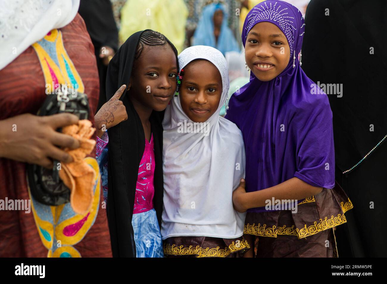 Senegalese girls pose for a photo after praying during the Eid al-Adha ...