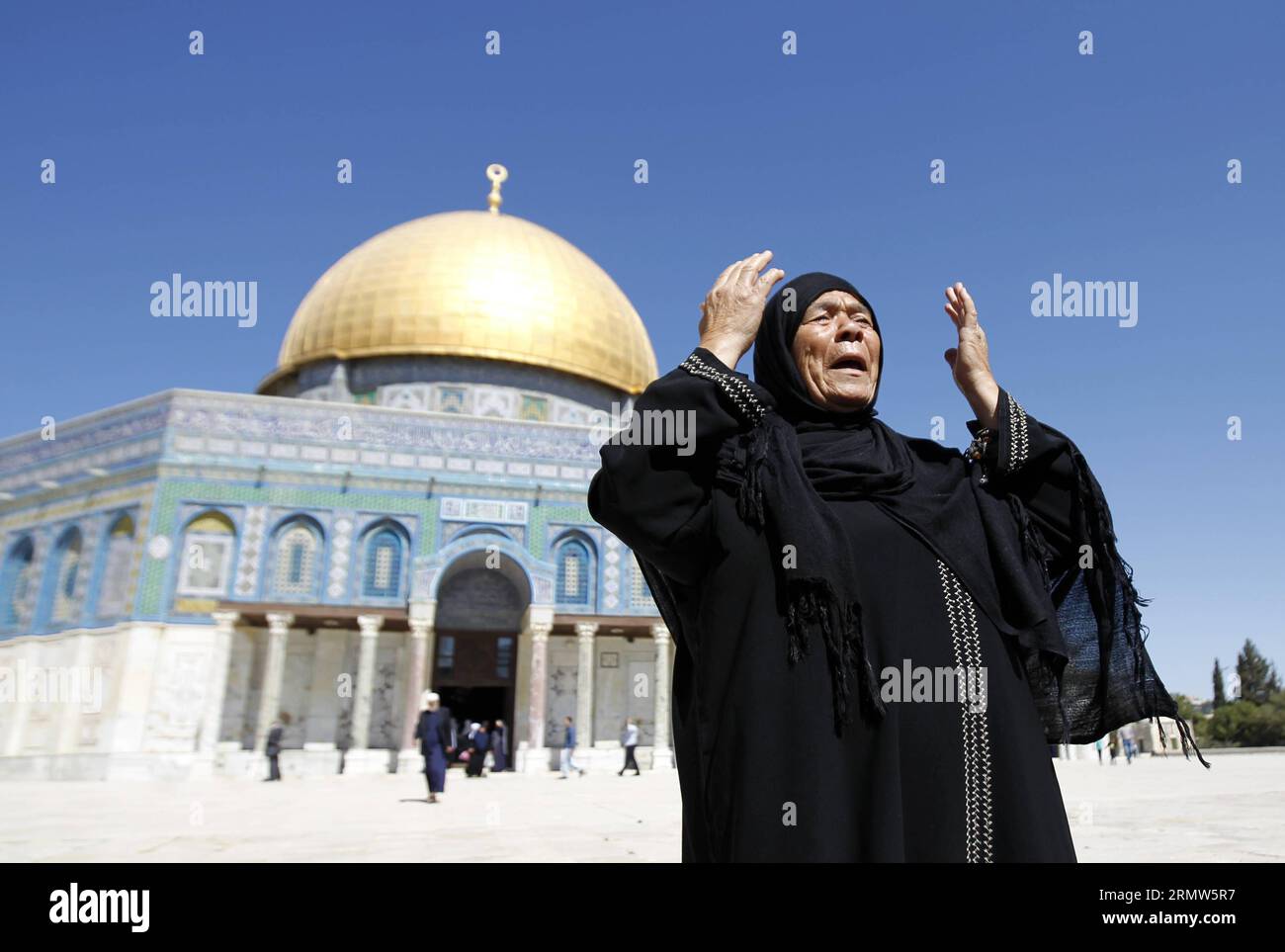 A Palestinian woman from the Gaza Strip pray outside the Dome of the ...
