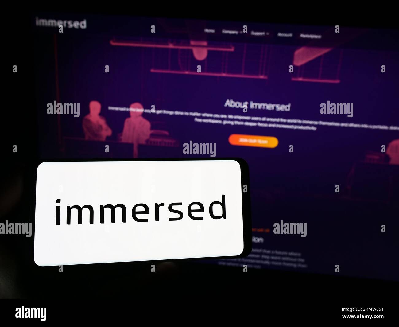 Person holding smartphone with logo of US virtual reality company ...