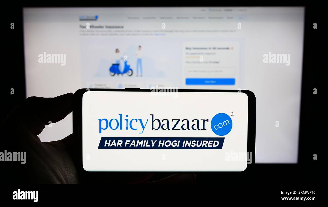 Person holding mobile phone with logo of Indian financial platform ...