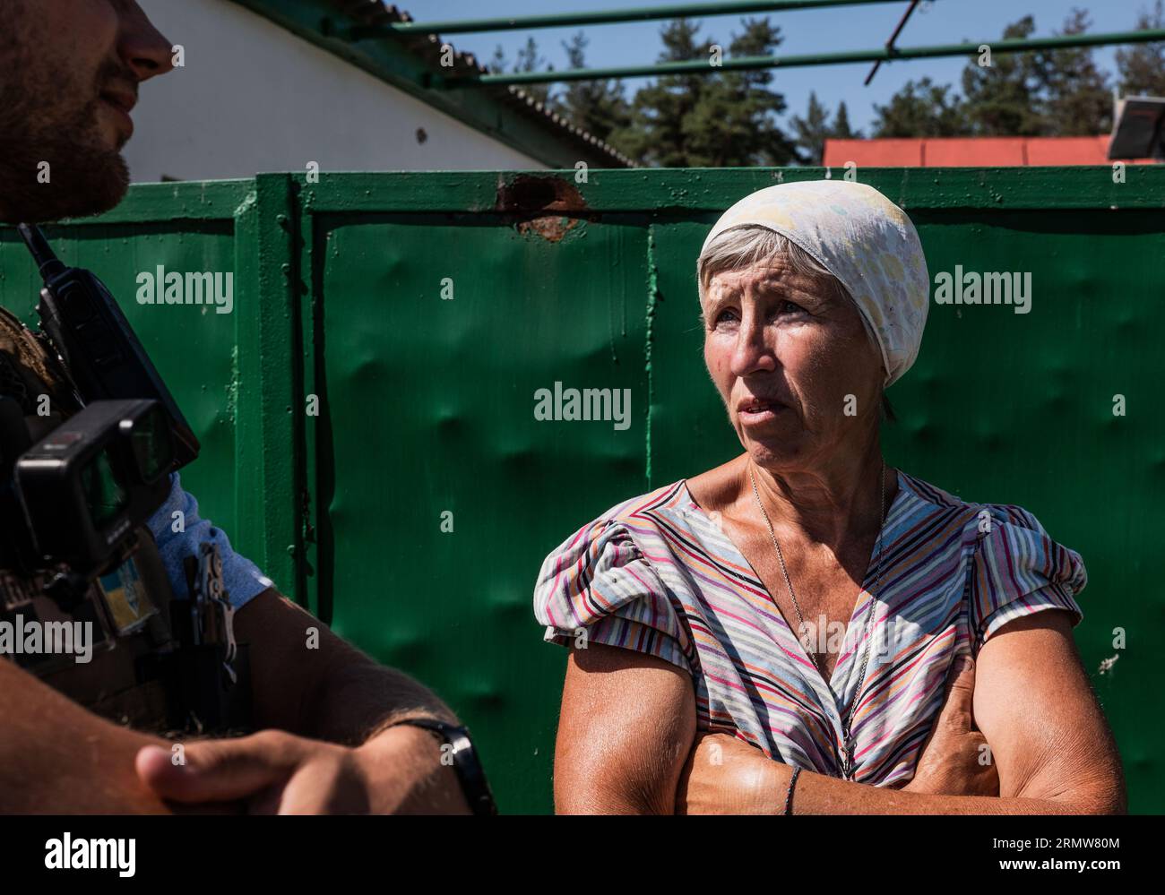 Podoly, Ukraine. 30th Aug, 2023. Iryna, 65, welcomes a volunteer ...