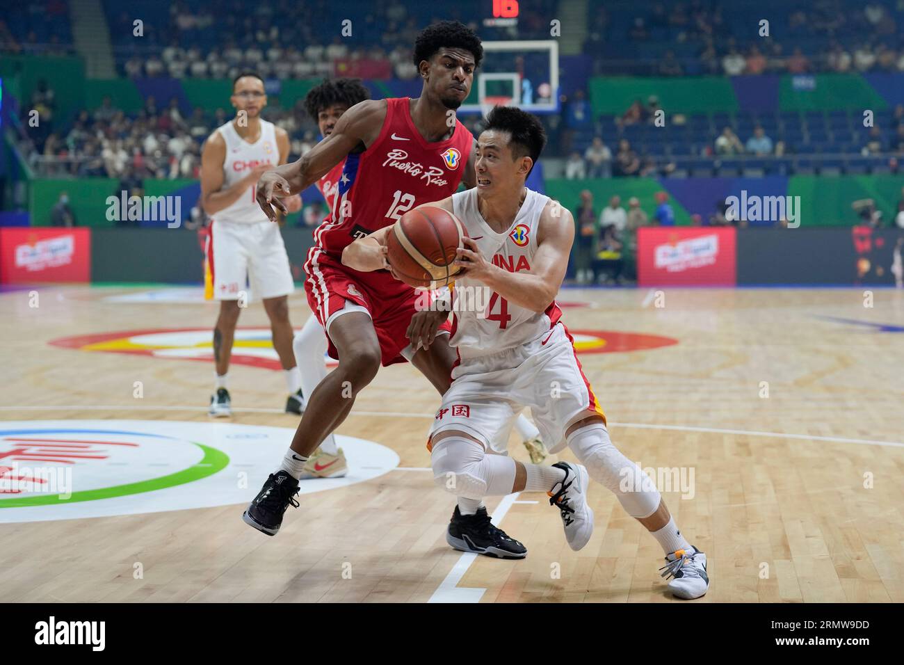 China guard Zhao Jiwei (4) against Puerto Rico forward Aleem Ford (12) during their Basketball ...