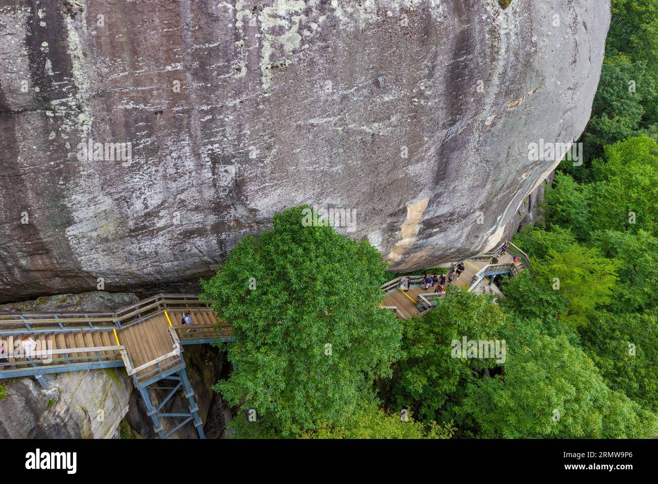 Chimney Rock, North Carolina, USA - August 11, 2023:People travel by ...
