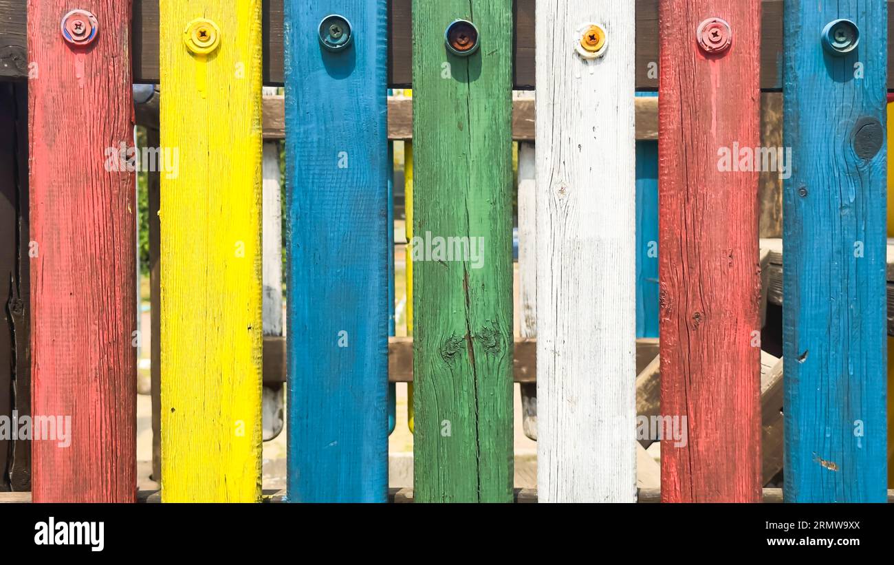 Bright, multi colorful fence on children's playground. High quality ...