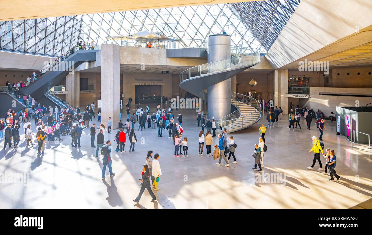 PARIS, FRANCE - APRIL 16, 2023: Crowded entrance hall under the glass ...