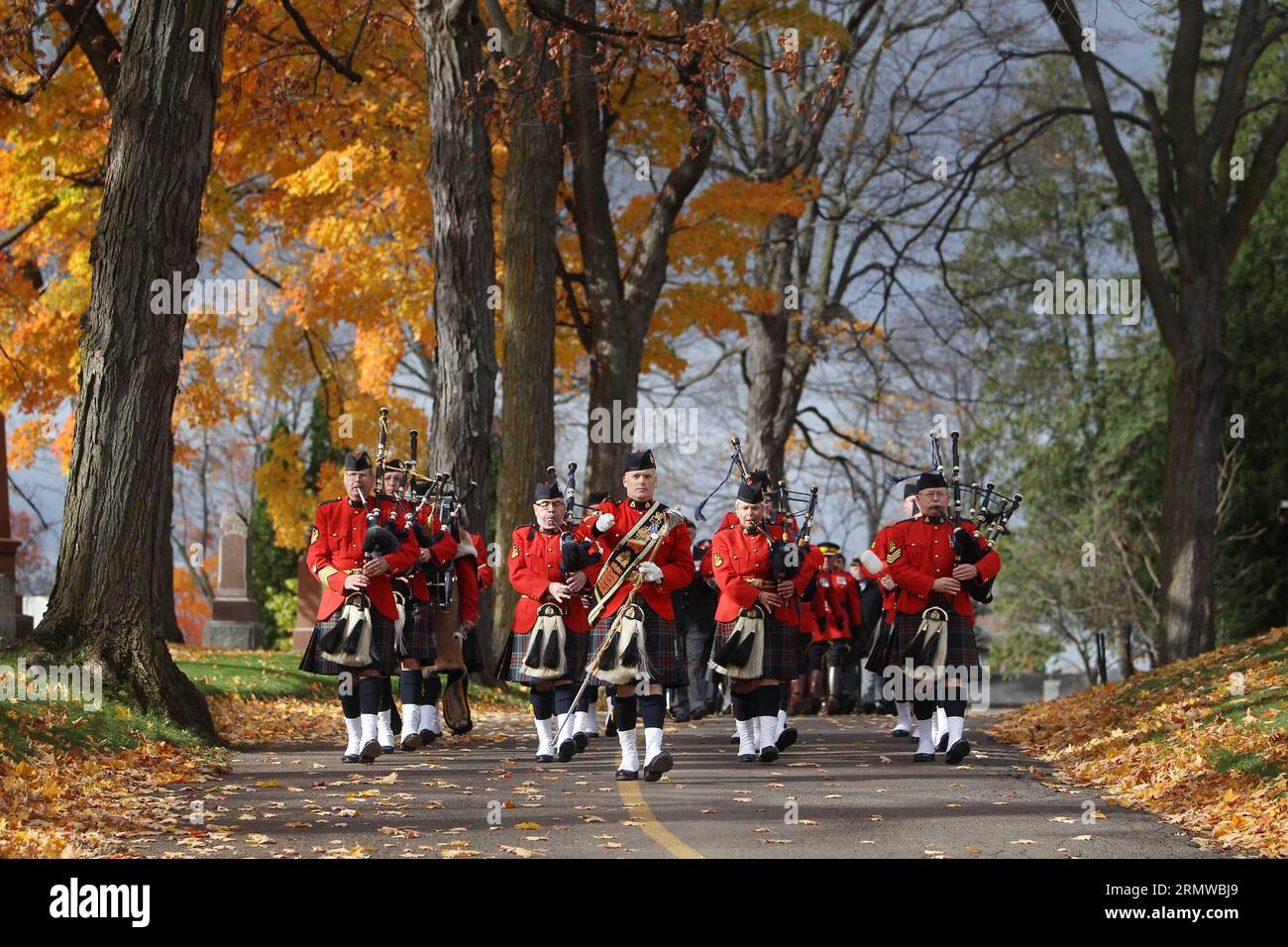 Royal Canadian Mounted Police (RCMP) walk through Beechwood Cemetery to ...