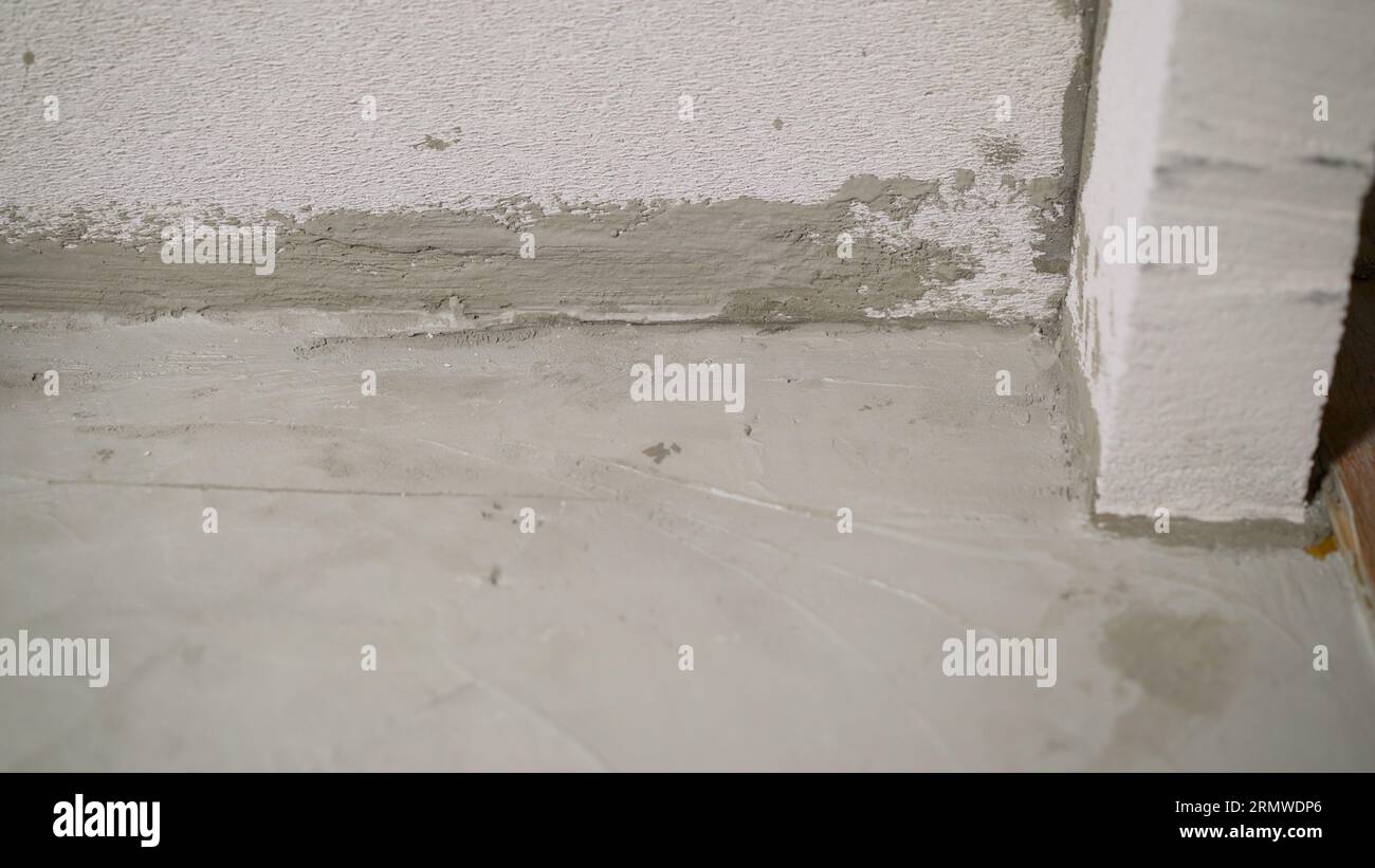 Applying a waterproofing layer to the surface. Close-up of a concrete ...