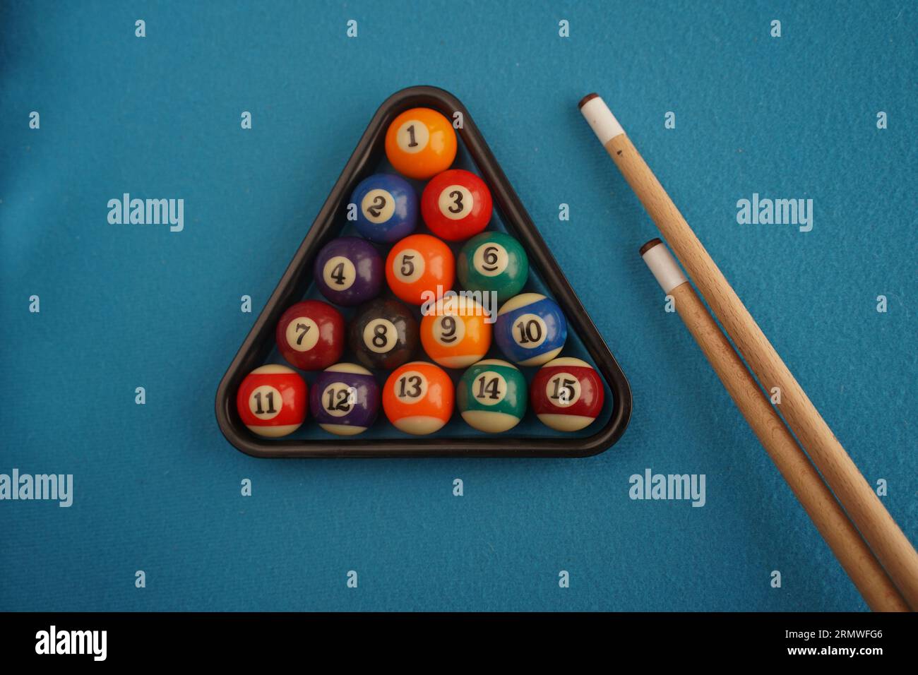Snooker balls and cue on blue background. Billiard balls on the board ...