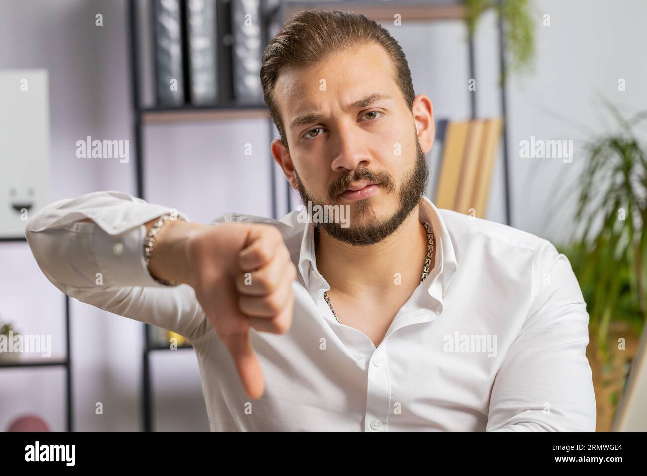 Dislike. Upset middle eastern businessman guy working on laptop ...
