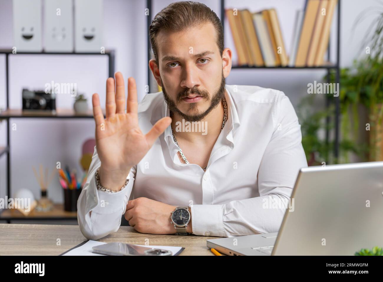 Stop. Lebanese businessman working on laptop, warning of finish ...
