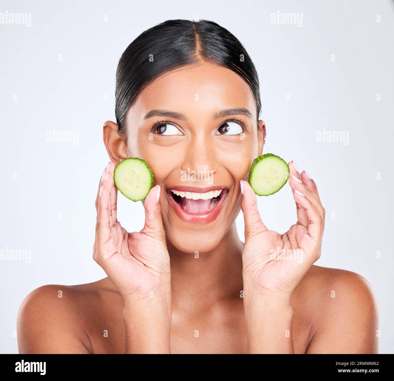 Face, excited and woman with cucumber, beauty and facial with natural ...