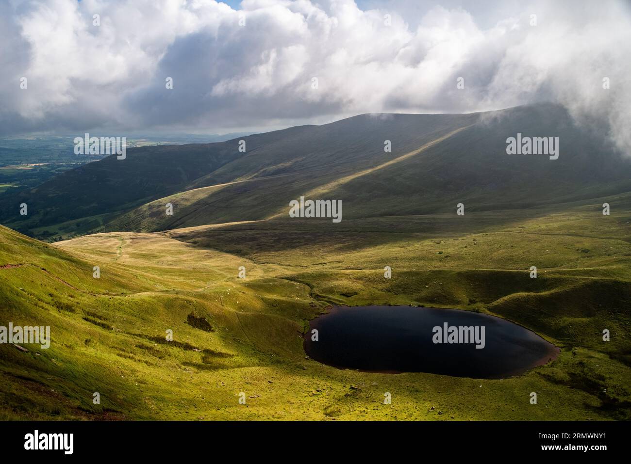 An aerial view of The peaks of the Brecon Beacons, Wales during foggy ...
